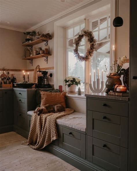 A Kitchen Filled With Lots Of Counter Top Space Next To A Window