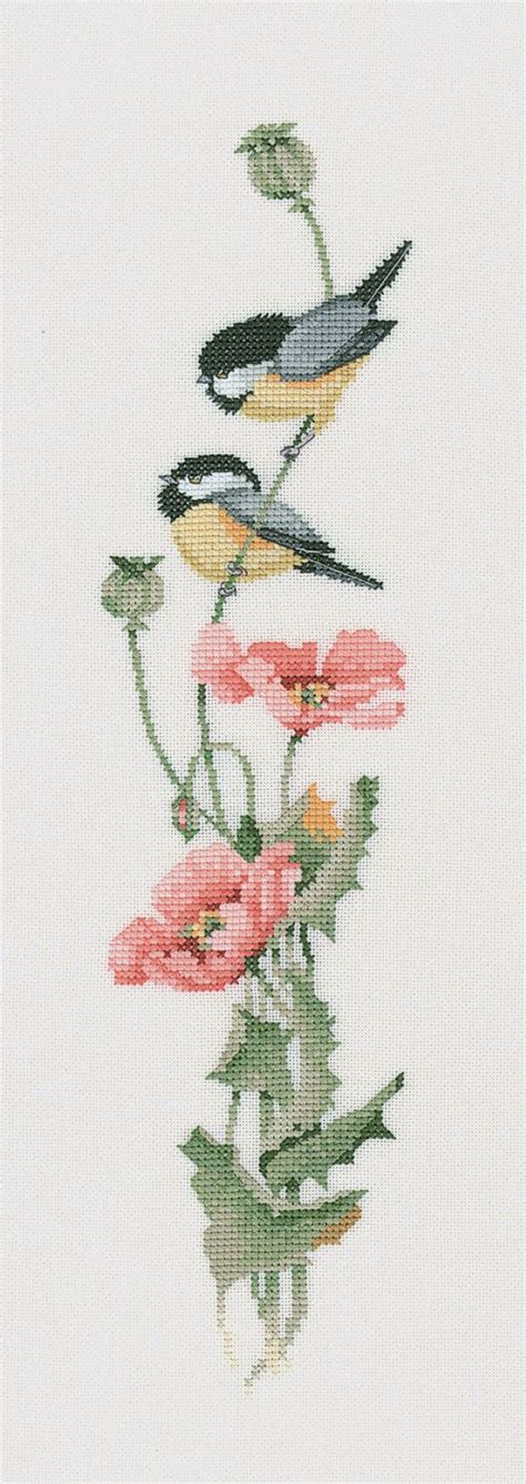 A Cross Stitch Pattern With Birds And Flowers