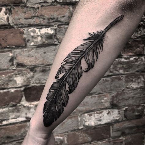 Big Black Feather Tattoo Inked On The Left Forearm Cage Tattoos Belly