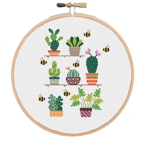 A Cross Stitch Pattern With Cacti And Succulents In Potted Plants