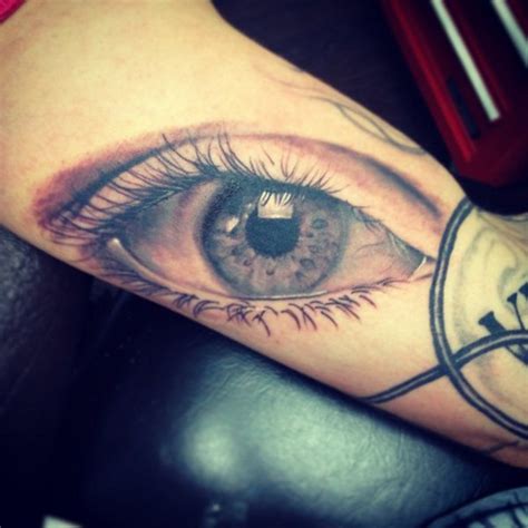Very Realistic Colored Big Sad Eye Tattoo On Arm Tattooimages Biz