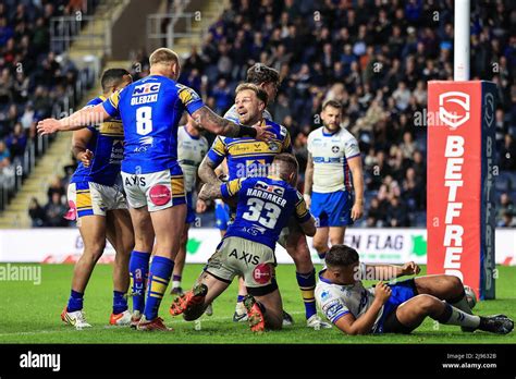 Blake Austin Of Leeds Rhinos Celebrates His Try With Team Mates Stock