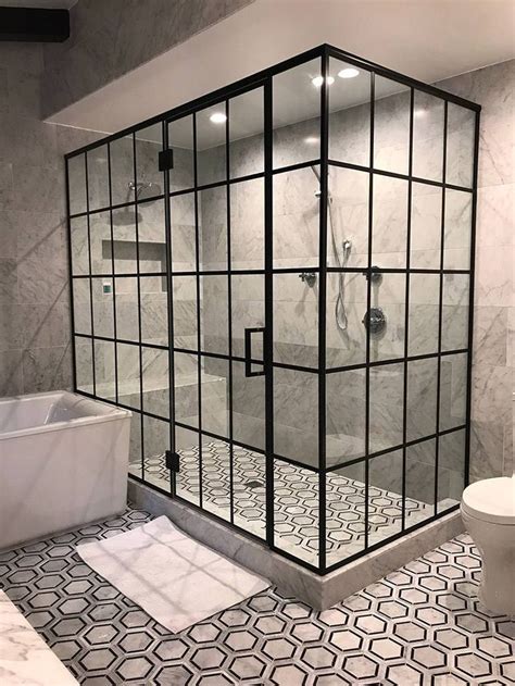 A Bathroom With A Glass Enclosed Shower Stall