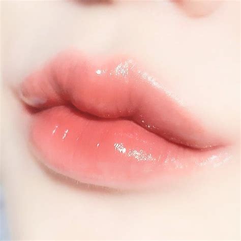 A Woman S Lips With Pink Lipstick On Her Cheek And The Bottom Part Of