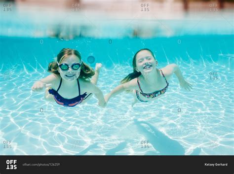 Girls Swimming Together In A Pool Stock Photo Offset