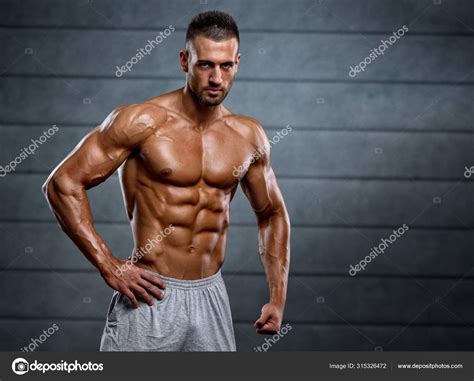 Men Flexing Muscles Telegraph