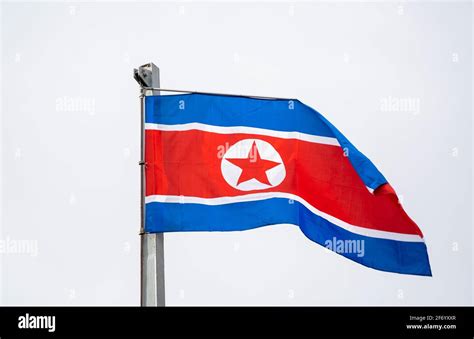 Flag Of North Korean Waving In The Sky Stock Photo Alamy