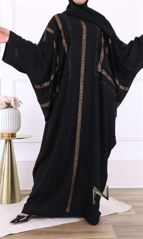 Abaya Dubai papillon manches papillon larges style émirati motifs