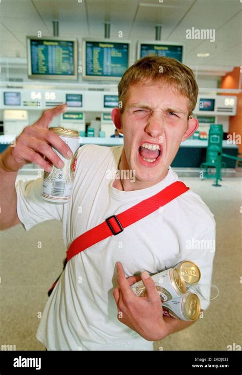 Drunken Man Holding Beer Cans Shouting At An Airport Alcohol Consumption Can Reduce Inhibitions
