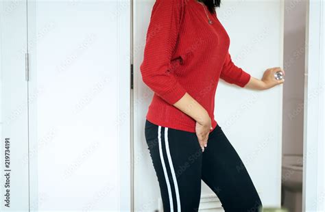 Hands Woman Holding Her Crotch At Toilet Female Need To Pee Stock Photo