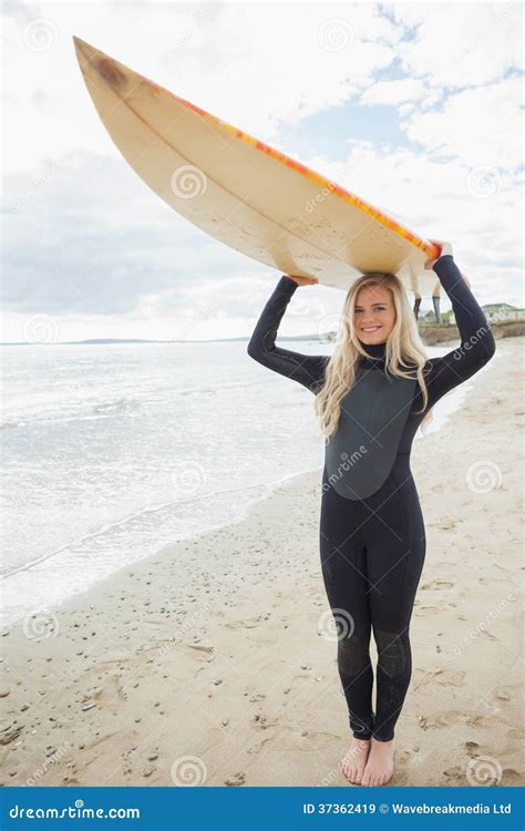 Woman In Wet Suit Holding Surfboard Over Head At Beach Stock Image Image Of Toned Outdoors