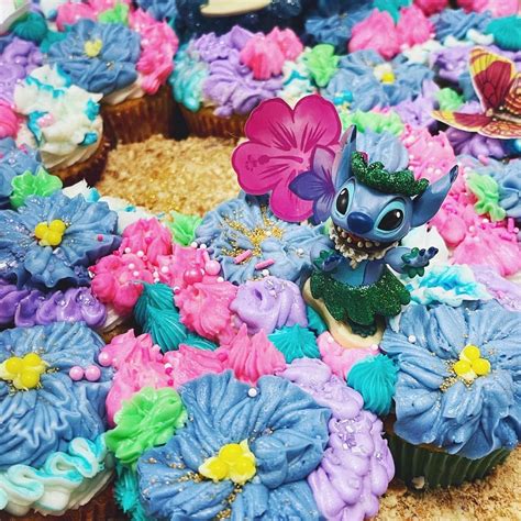 Cupcakes With Blue Frosting And Colorful Decorations
