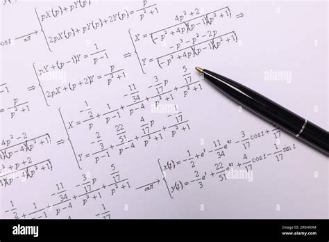 Sheet Of Paper With Mathematical Formulas And Pen Top View Stock Photo