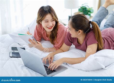 Millennial Asian Young Happy Cheerful Female Teenager Lgbtq Lesbian Lover Couple Laying Down