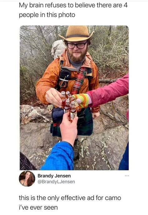 The Man Is Taking Pictures With His Cell Phone While Another Person