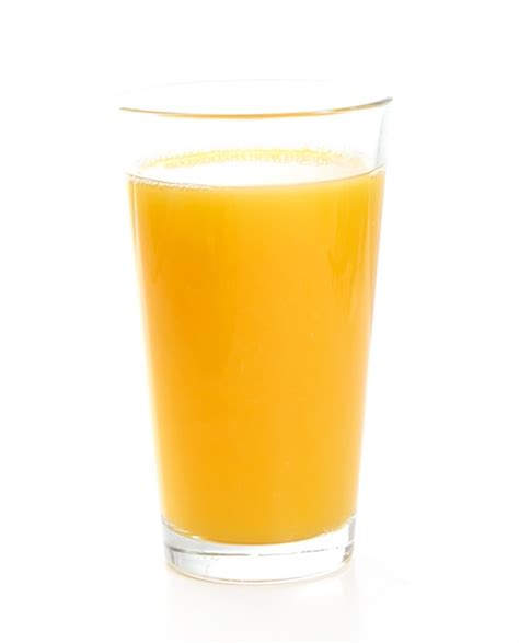 Delicioso copo de suco de laranja Foto Grátis