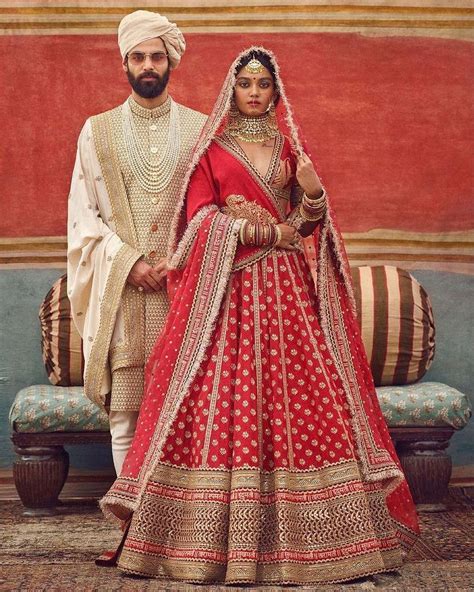 Couple Wedding Outfits By Sabyasachi Sabyasachi Bridal Red Bridal