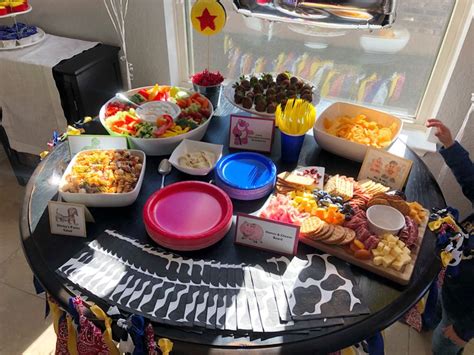 A Table Filled With Lots Of Different Foods And Desserts On Top Of Each
