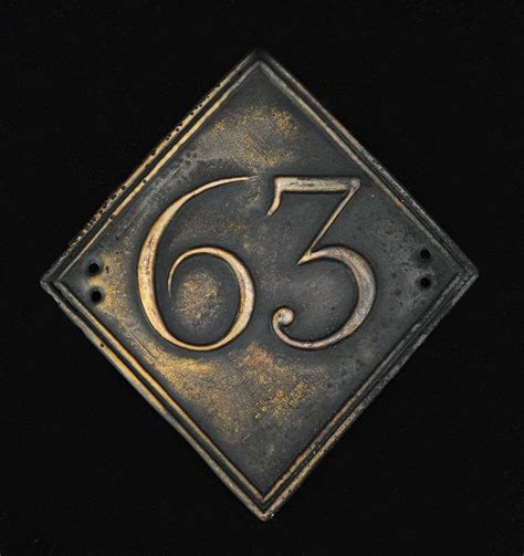 PLAQUE DE SHAKO modèle 1810 DU 63ème RÉGIMENT D INFANTERIE DE LIGNE