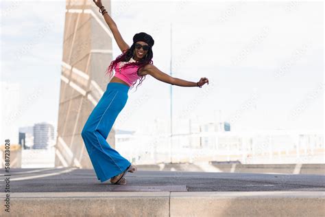 Black Woman On Roller Skates Riding Outside On Urban Street Modern
