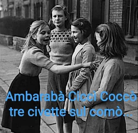 Three Women Are Talking To Each Other On The Sidewalk