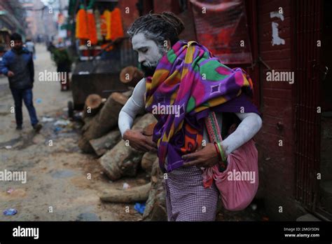 A Hindu Holy Man Smeared In Ash Walks Towards Pashupati Temple In