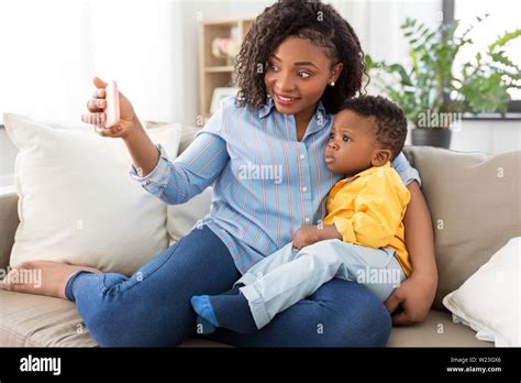 African Mother With Baby Son Taking Selfie At Home Stock Photo Alamy