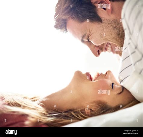 Love And Laughter Two Of Lifes Most Greatest Pleasures An Affectionate Young Couple Gazing