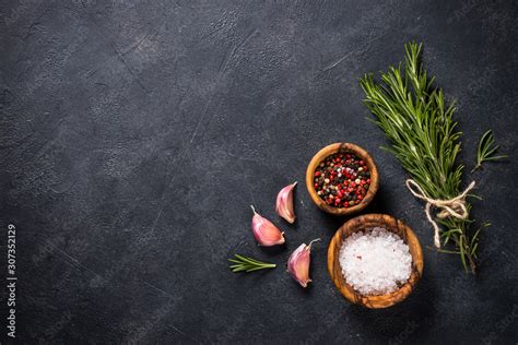 Food Cooking Background With Herbs And Spices On Black Stock Photo