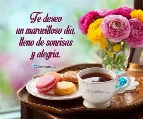 A Cup Of Coffee And Some Cookies On A Wooden Tray With Flowers In The