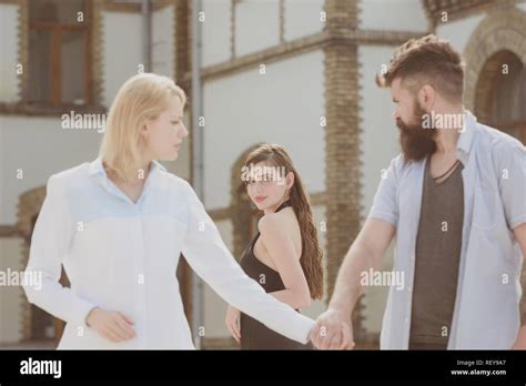 He Is Nothing But A Womanizer Hipster Choosing Between Two Women Bearded Man Looking At Other