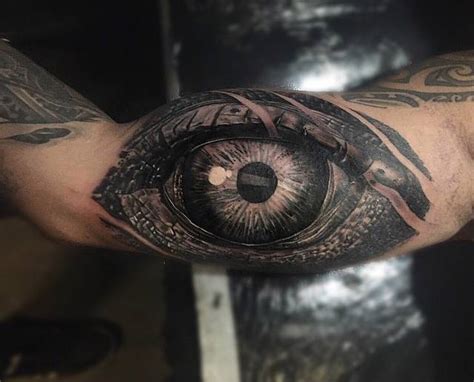 Black And Grey Style Eye Tattoo On The Right Inner Arm