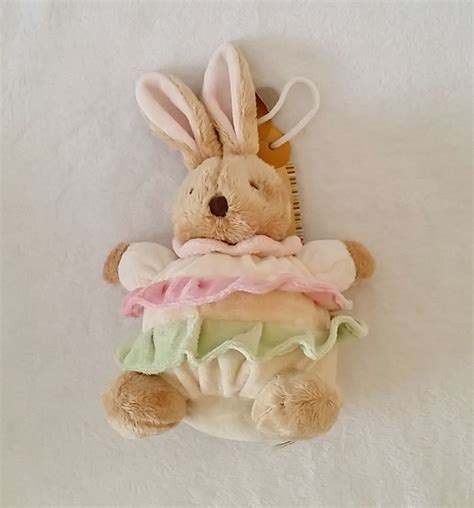 Doudou Lapin boule marron écru volants rose et vert BABY NAT