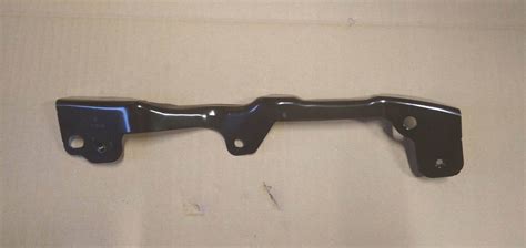 Wspornik lampy przedniego lewego błotnika Tesla 3 nowy oryginał 1487582