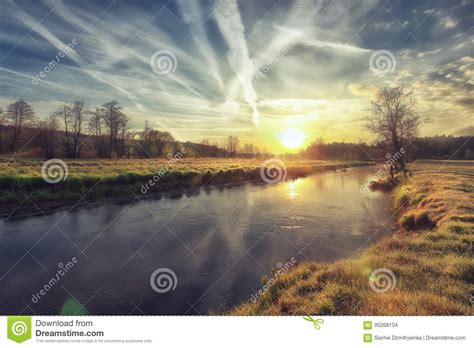 A Beautiful Sunrise Over River In Golden Autumn Morning Stock Photo
