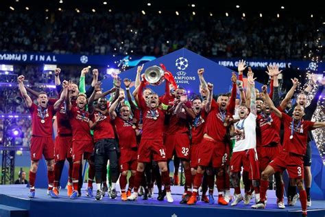 The Liverpool United Team Celebrate With The Trophy