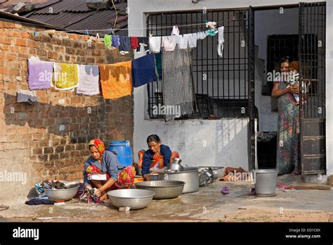 Village Women Doing Laundry In Front Of Home Gujarat India Stock
