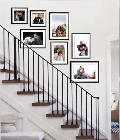 A Staircase With Pictures Hanging On The Wall
