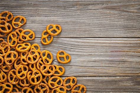 Premium Photo Salted Mini Pretzels On A Wooden Background Top View