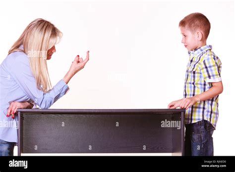 Relationships Arguments And Discussion Mother And Son Sit At Table And