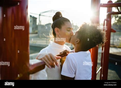 Loving Mother And Son Kissing On Mouth At Playground Stock Photo Alamy