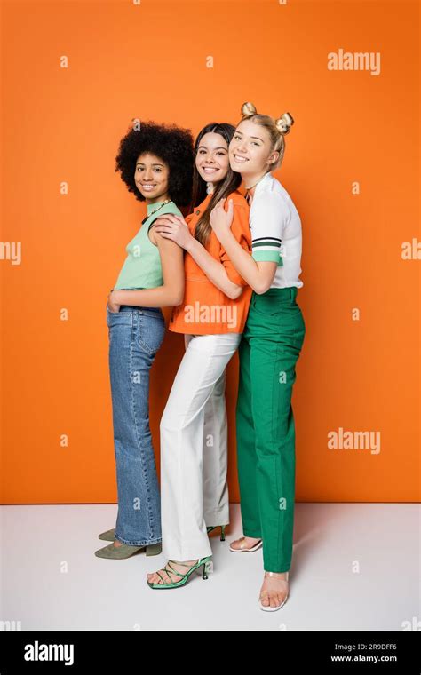 Full Length Of Trendy Multiethnic Teenagers With Bold Makeup Wearing