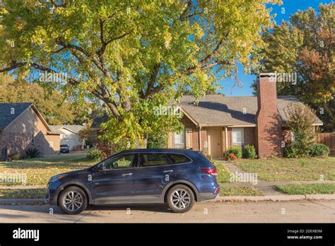 Typical Residential Street With Parked Car In Front Of Residential