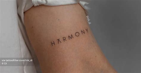 Tattoo Of The Word Harmony Located On The Bicep