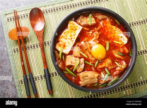 Spicy Soft Tofu Stew With Kimchi And Pork Belly Closeup On The Bowl On The Table Horizontal Top