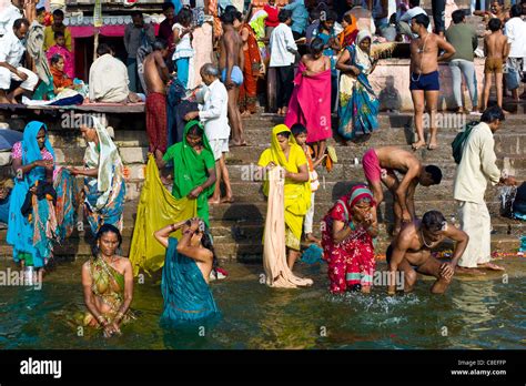Indian Hindu Pilgrims Bathing In The Ganges River At Dashashwamedh Ghat