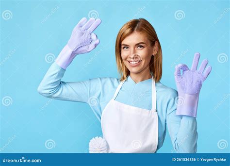 Woman In Violet Rubber Gloves And Cleaner Apron Showing Ok Stock Photo