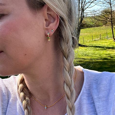 Køb Glow øreringe i 18 karat guldbelagt sølv med blå topas og diamant