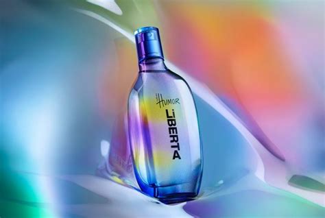 An Empty Bottle Sitting On Top Of A Liquid Filled Glass Container With