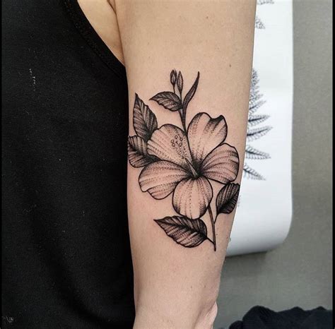 Hibiscus Flower Tattoo On The Left Upper Arm